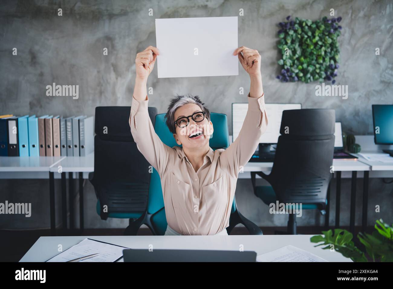 Photo of happy charming senior lady secretary wear formal shirt rising ...