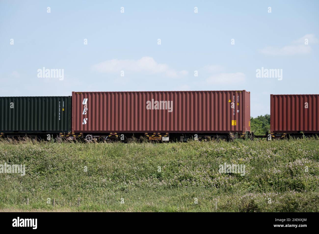 UES shipping container on a Freightliner train, Warwickshire, UK Stock ...