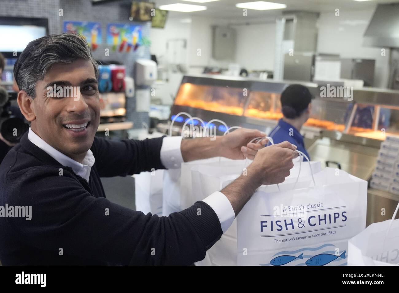 Prime Minister Rishi Sunak buys traditional fish and chips for the ...