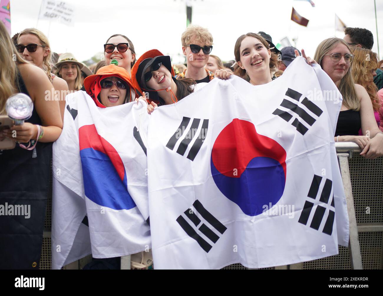 Fans of the South Korean K-pop band Seventeen in the crowd before their ...