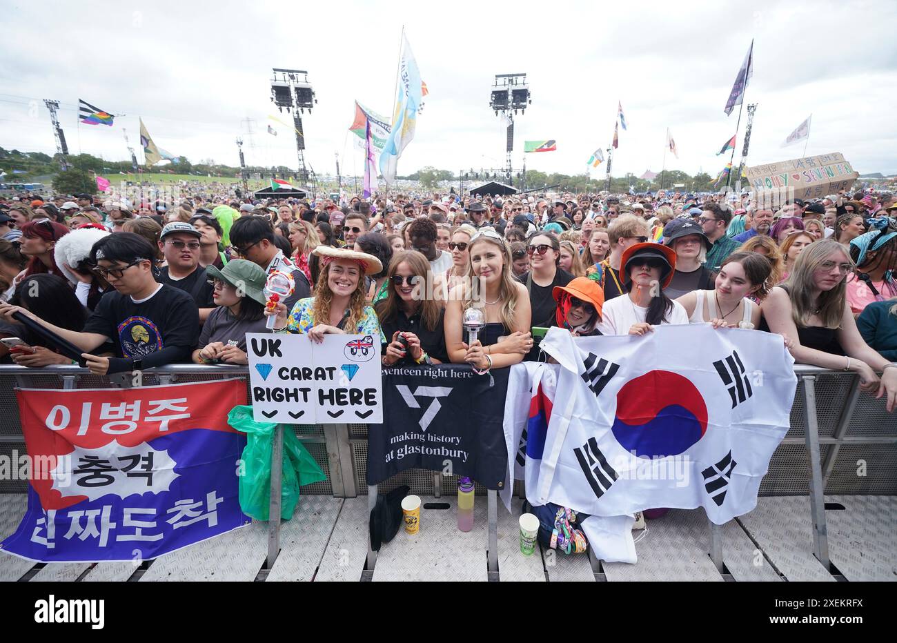 Fans of the South Korean K-pop band Seventeen in the crowd before their ...