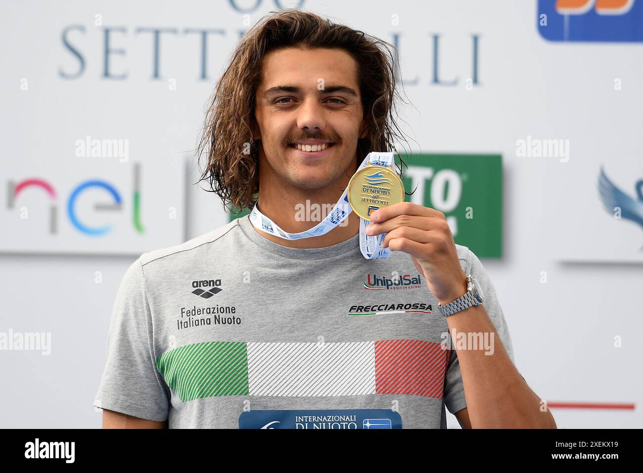 Thomas Ceccon of Italy, gold, attends the medal ceremony of the 100m ...