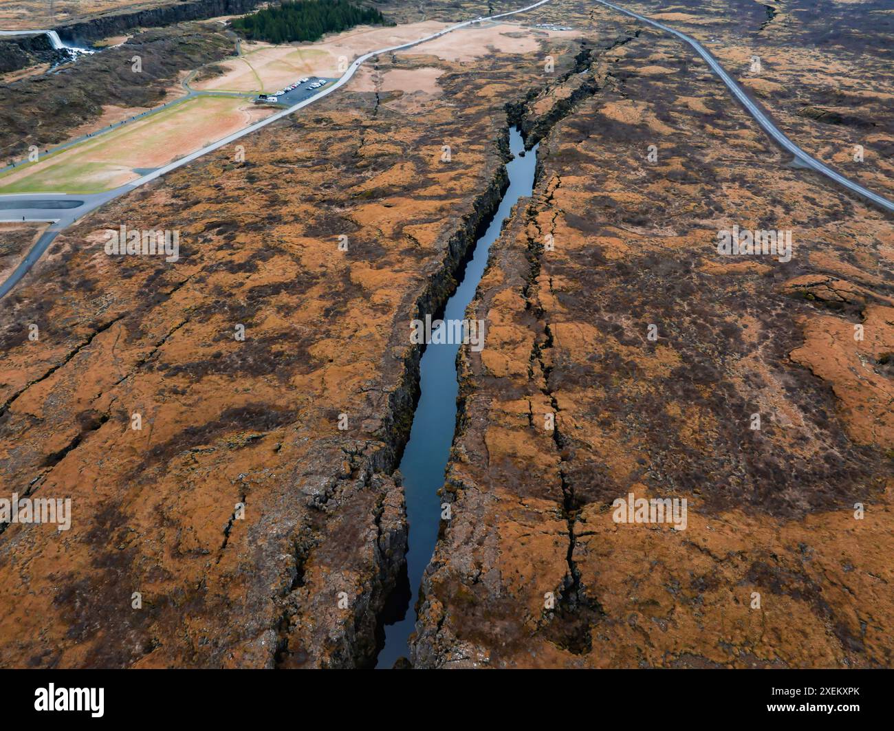 Aerial View of Deep Water-Filled Crack in Iceland's Rocky Terrain Stock ...