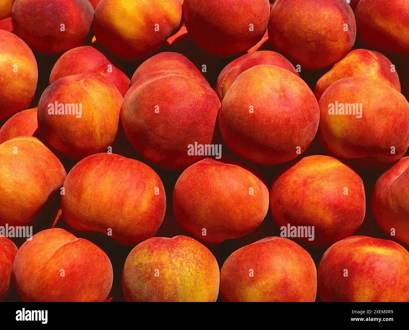 Close up view of a box of ripe peaches on a market stall Stock Photo ...