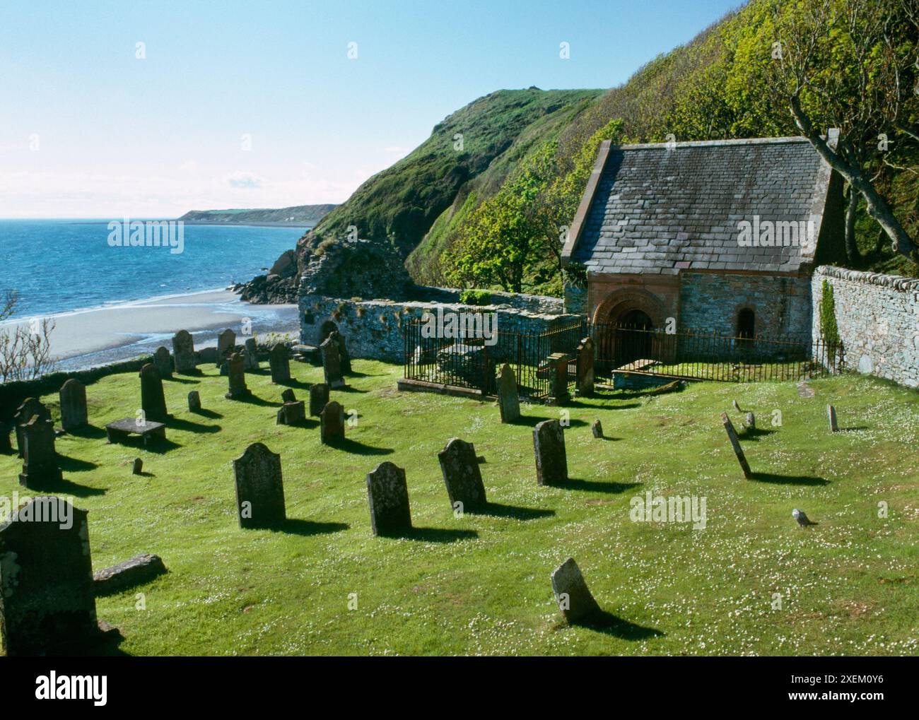 View NW of St Medan's ruined C12th church, C19th mausoleum & churchyard ...
