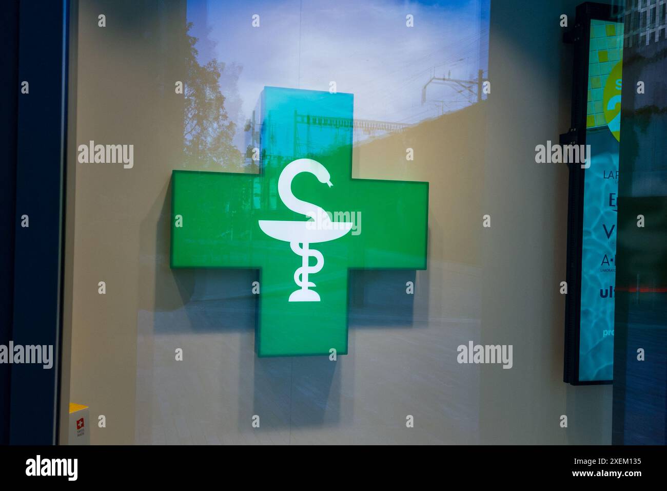 Lancy, Switzerland. 18th June, 2024. The luminous green cross of a ...