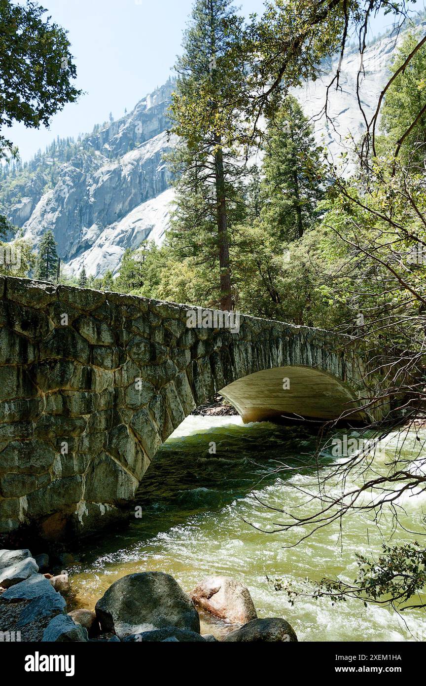 The Merced river flowing through the arches of Pohono bridge after recent flooding in Yosemite ...