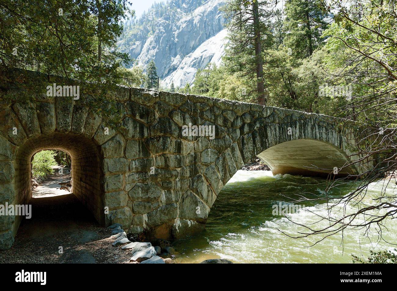 The Merced river flowing through the arches of Pohono bridge after recent flooding in Yosemite ...