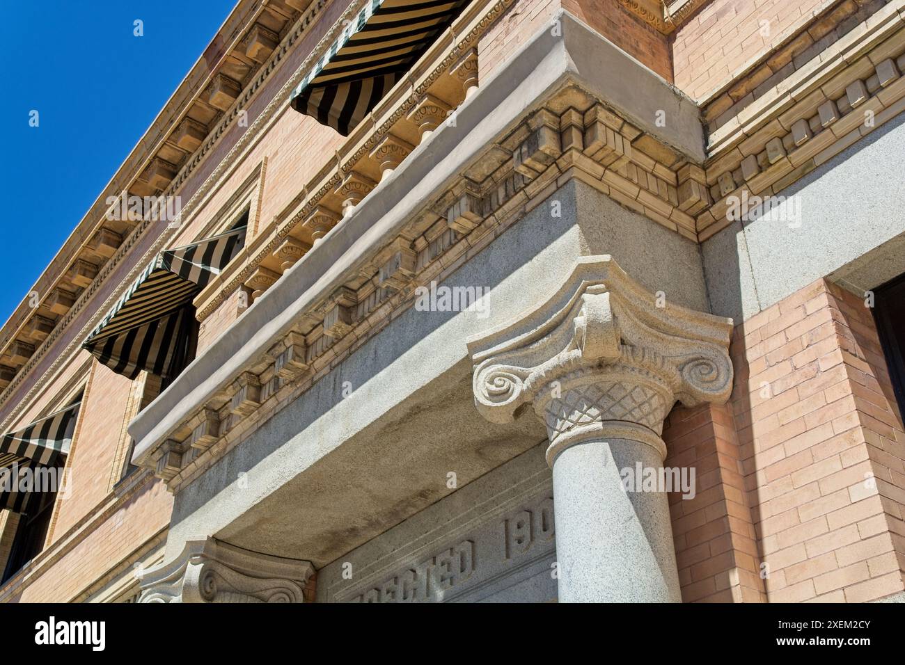 Ionic capital on granite column at entrance to yellow brick Prescott ...