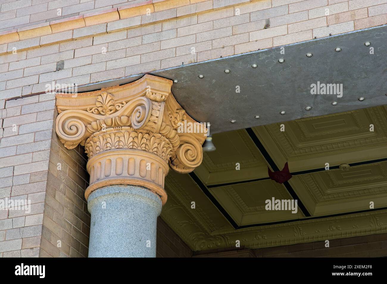 Close up of corinthian capitol on granite column in brick building facade Stock Photo - Alamy