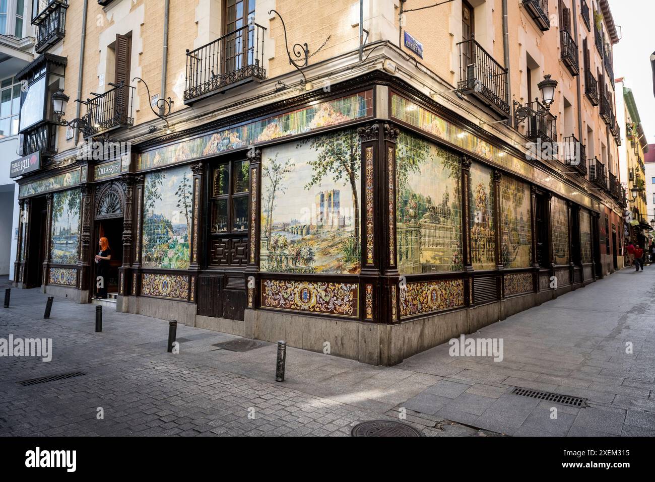 Tiled artwork on the facade of a tavern on a street corner in Madrid ...