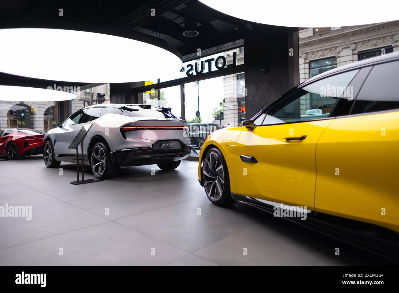 new yellow battery-Electric Hyper-GT Lotus Emeya in showroom, British ...