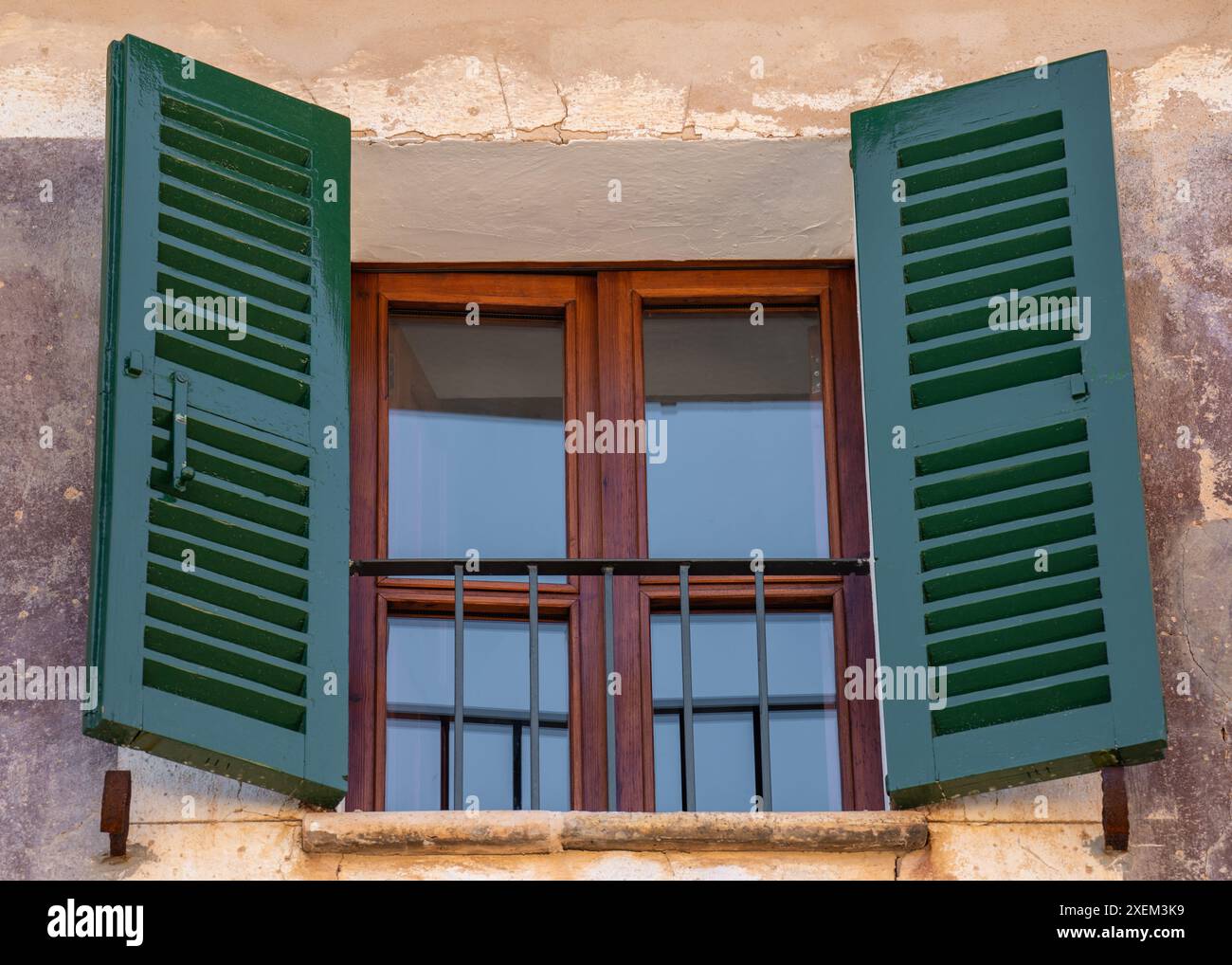 Brown window with green shutters Stock Photo - Alamy