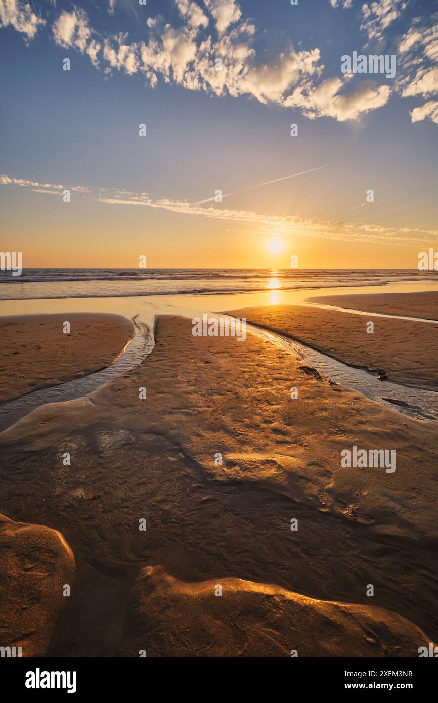 Atlantic ocean sunset with surging waves at Fonte da Telha beach ...