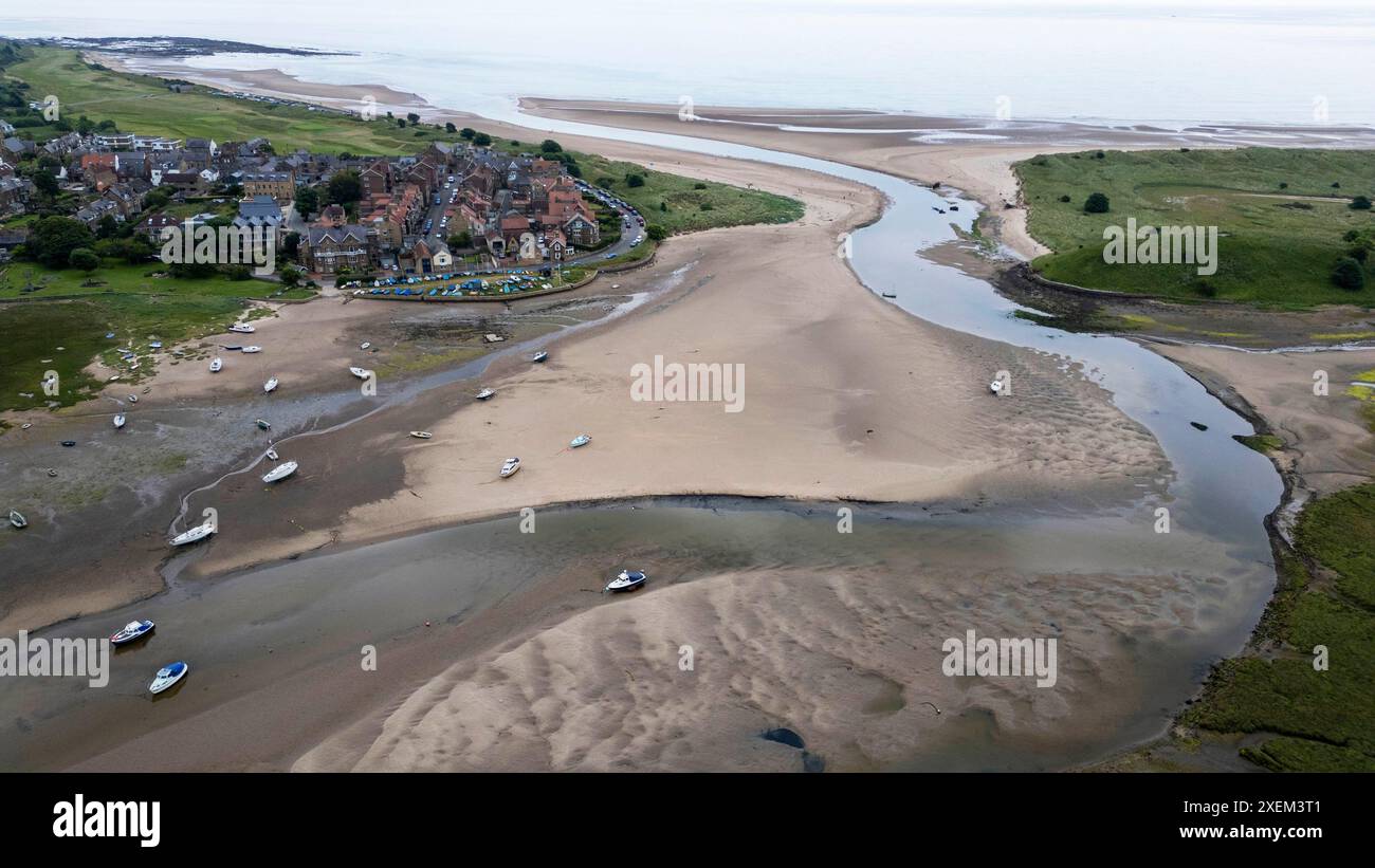 Aerial drone view of Alnmouth village and river Aln estuary ...