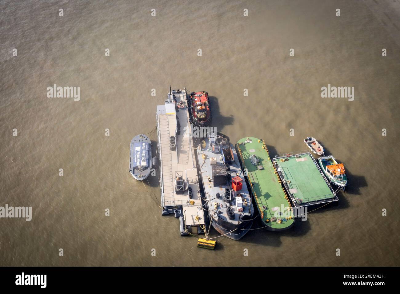 Barges and tugboats on the River Thames, viewed from directly above on ...