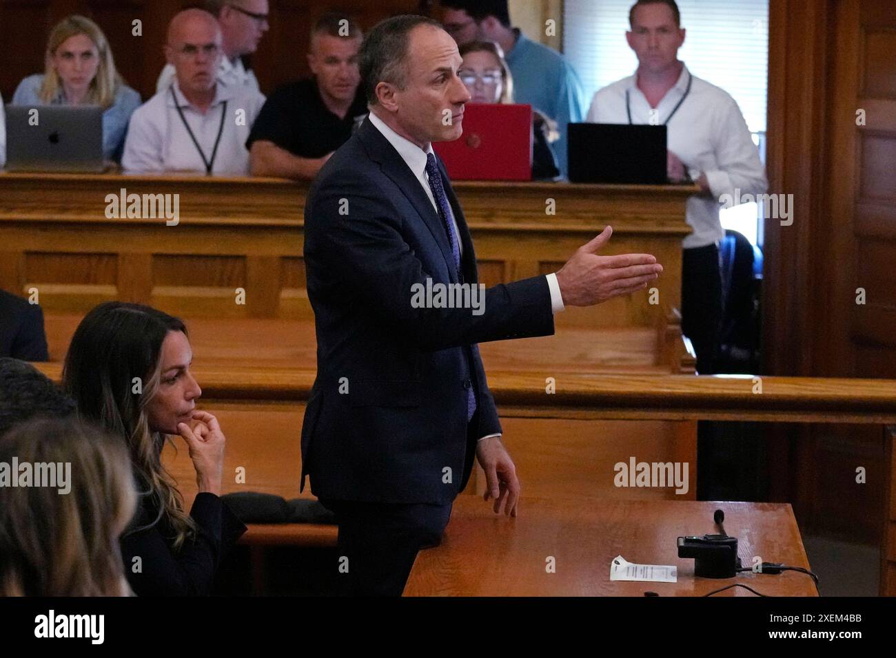 Defense attorney David Yannetti, standing, addresses the court as Karen ...