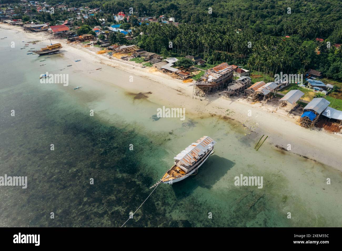 Aerial view of shipyard and boats along the coast of Sulawesi Selatan ...