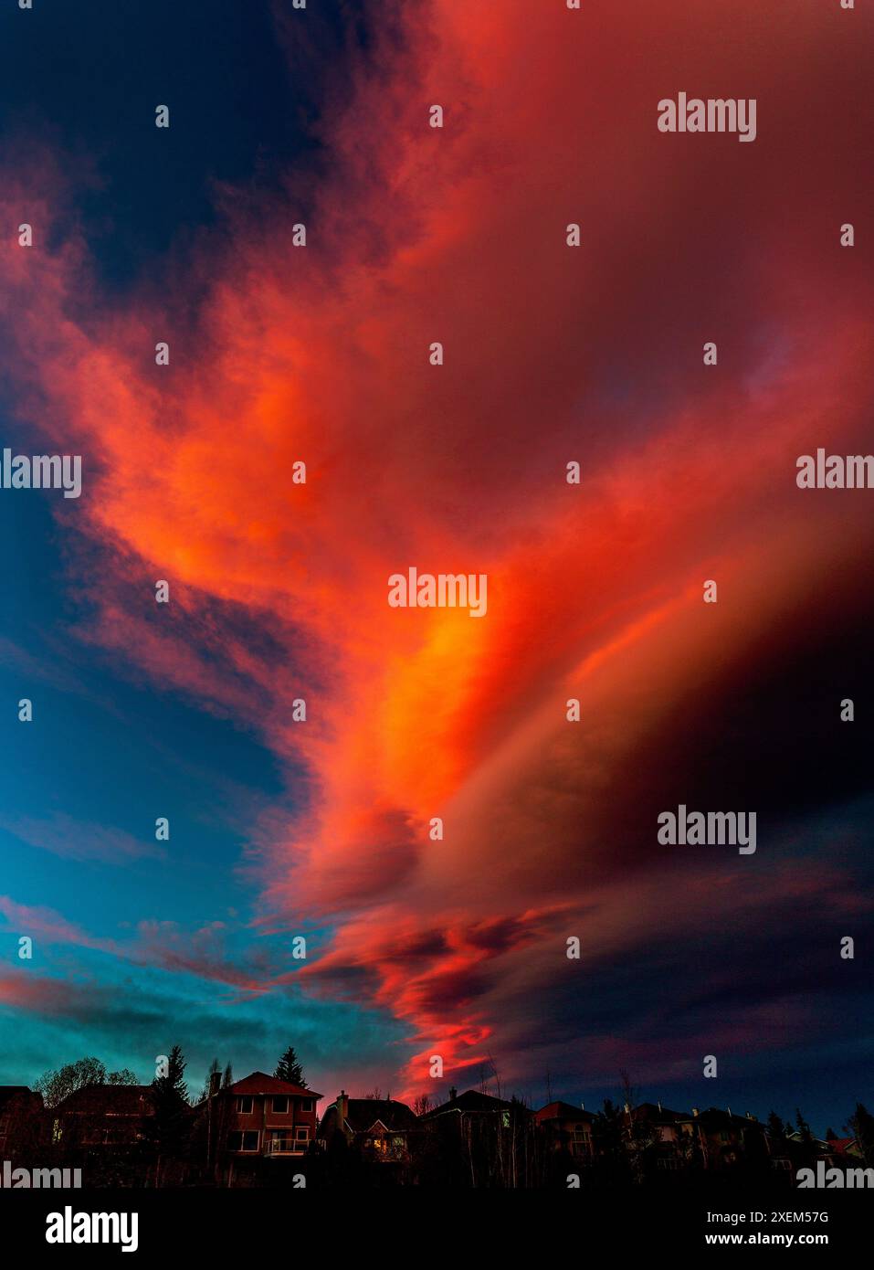 Dramatic colourful cloud formation above a residential area; Calgary ...