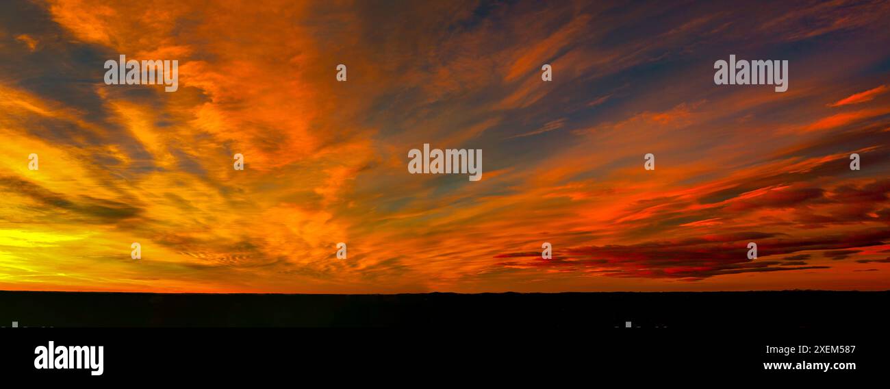Dramatic panorama of colourful cloud formations in a vast sky; Calgary ...
