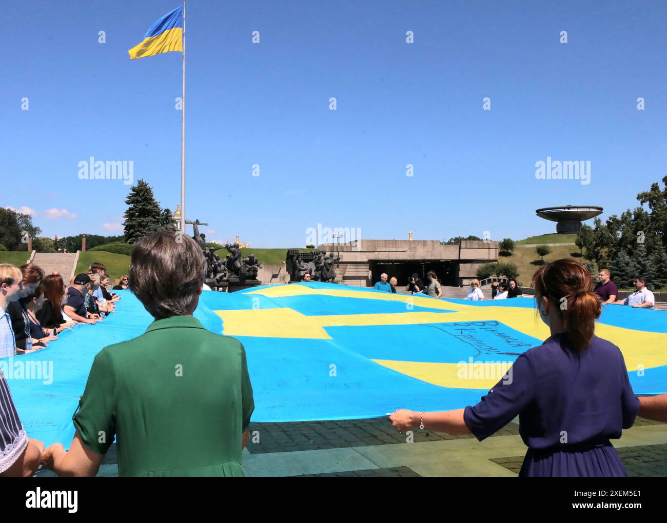 KYIV, UKRAINE - JUNE 26, 2024 - People attempt to set the national ...