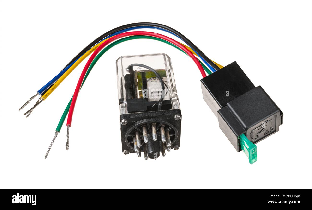 Two relay and green automotive fuse isolated on white background ...