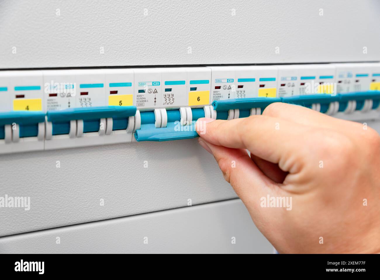 Turning off the power. Hand switch electric fuse Stock Photo - Alamy