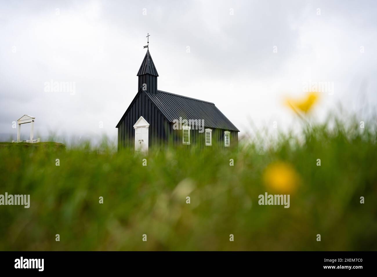 Stunning view of the black church of Budir with defocused grass in the ...