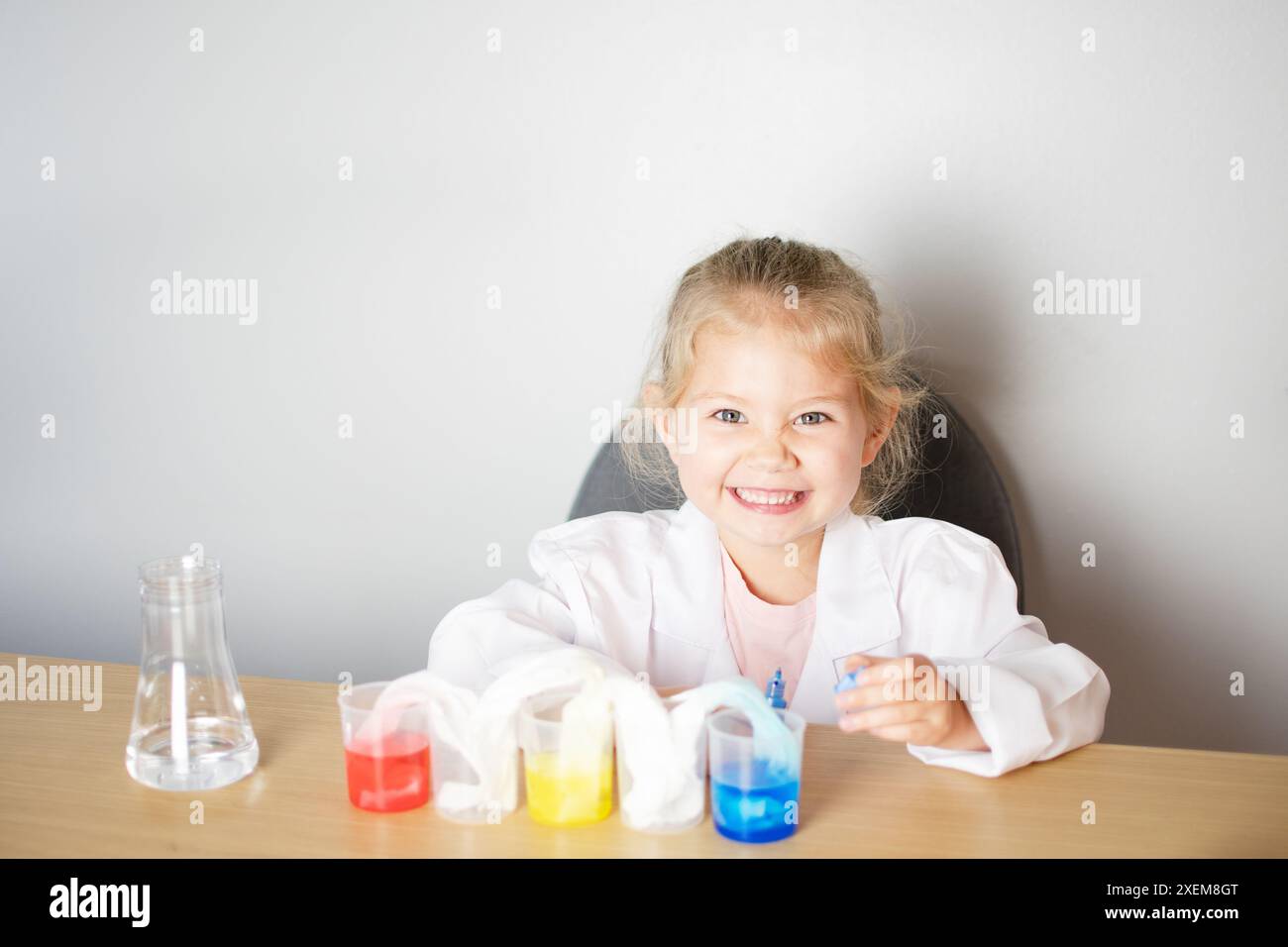 Little girl doing science experiment. Kindergarten. Education concept ...