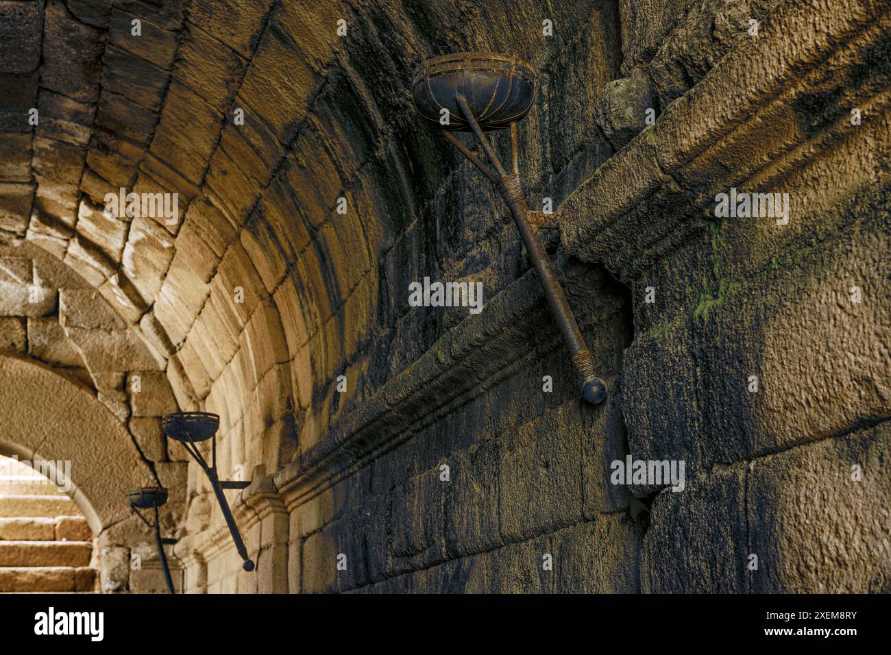 The passageway features intricate stonework and leads to the arena ...