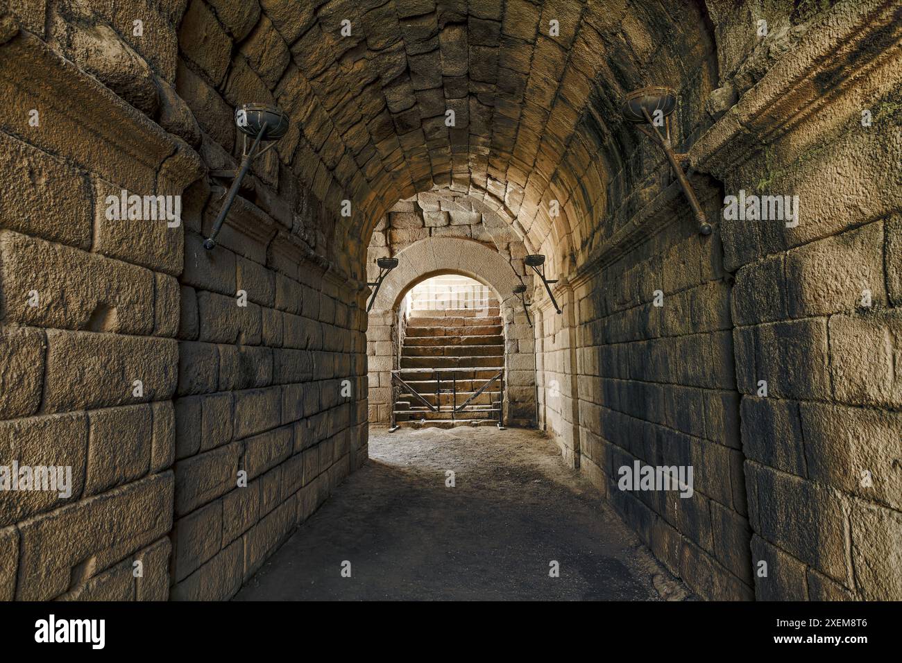 A stone corridor within the ancient Roman amphitheater in Merida, Spain ...