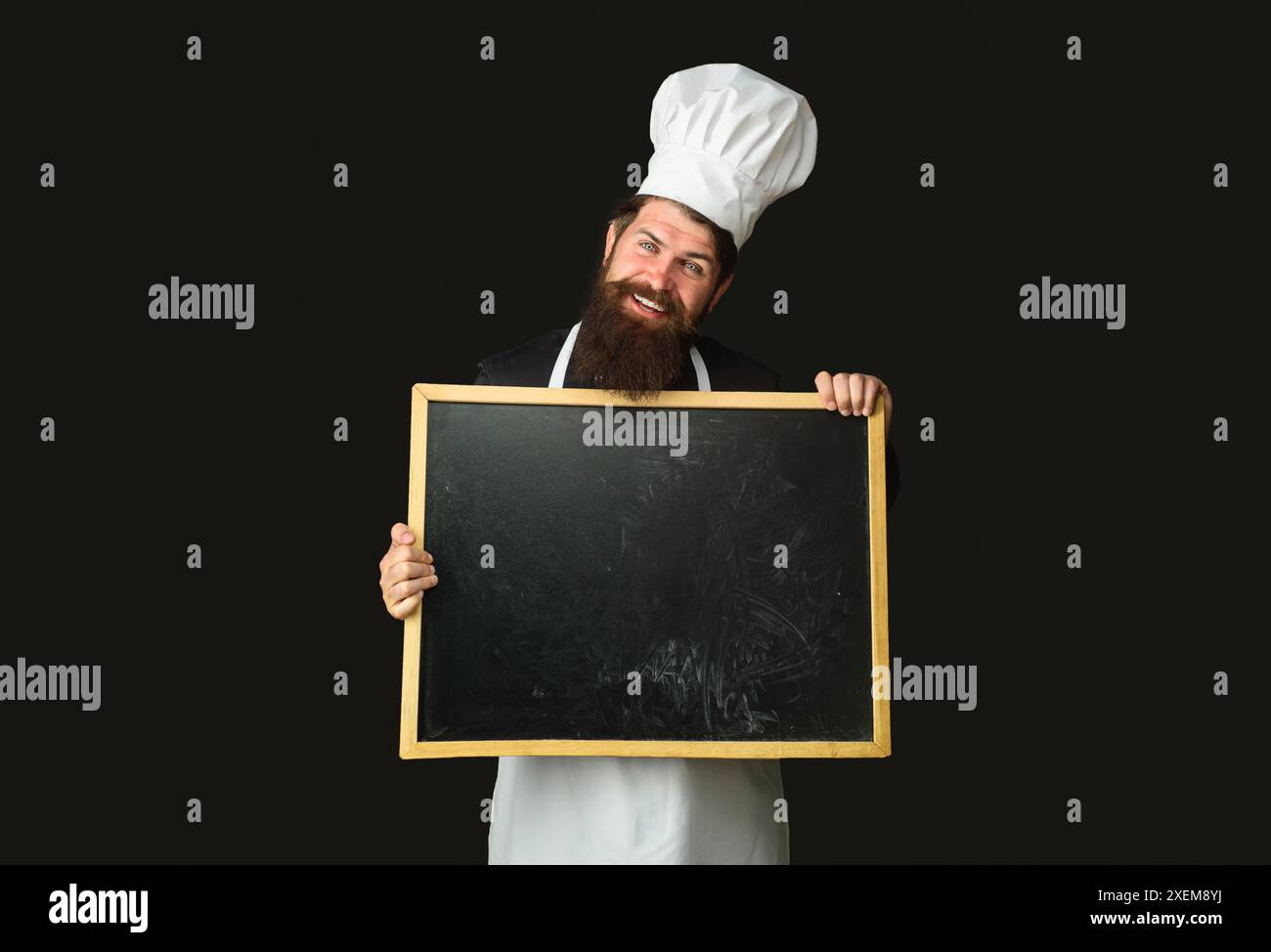 Chef menu for restaurant or cafe. Smiling chef showing empty blackboard ...