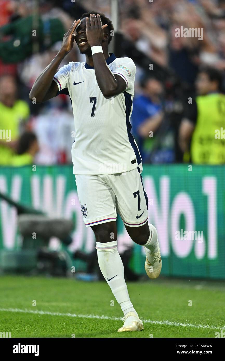 COLOGNE, GERMANY - JUNE 25: Bukayo Saka of England reacts after scoring ...