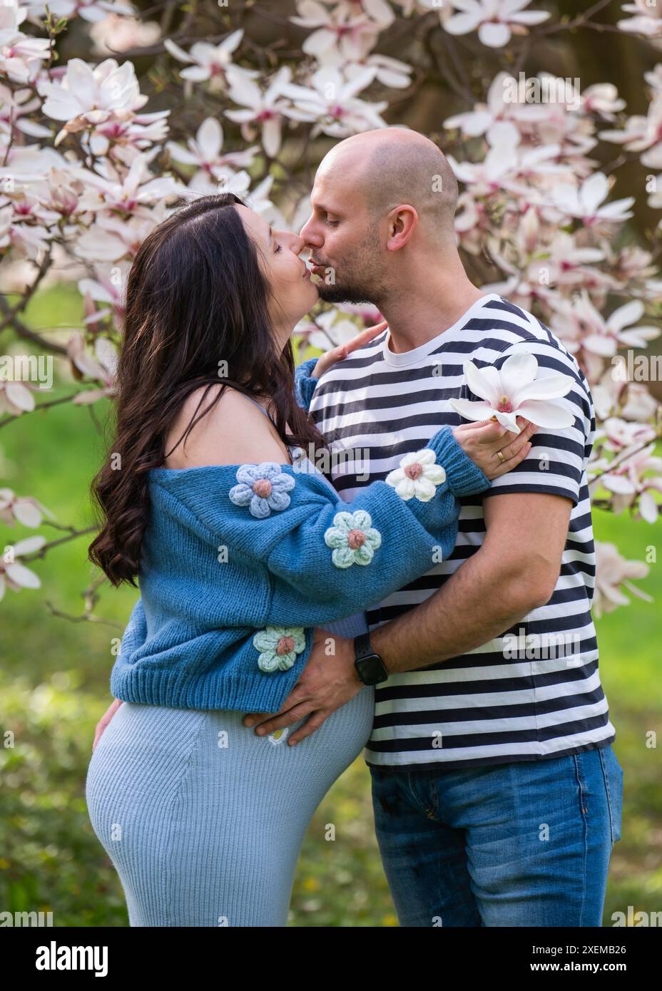 A happy family is expecting a baby and expresses their love for each ...