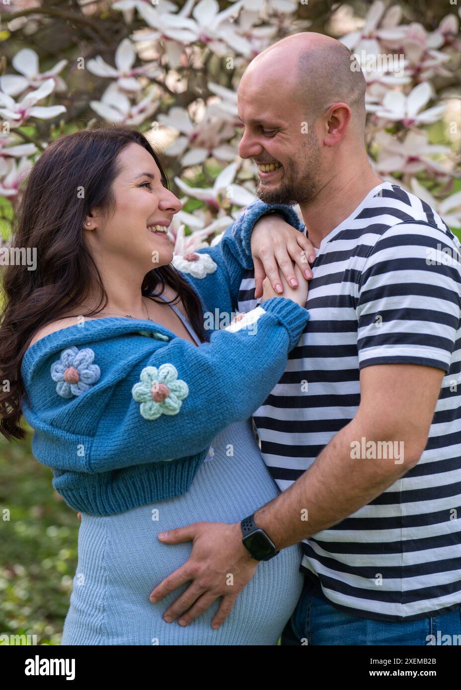 Happy family expecting a baby and expressing love for each other A man ...