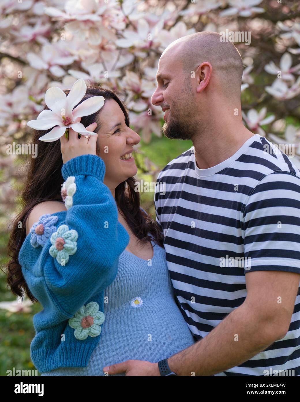 Happy family expecting a baby and expressing love for each other A man ...