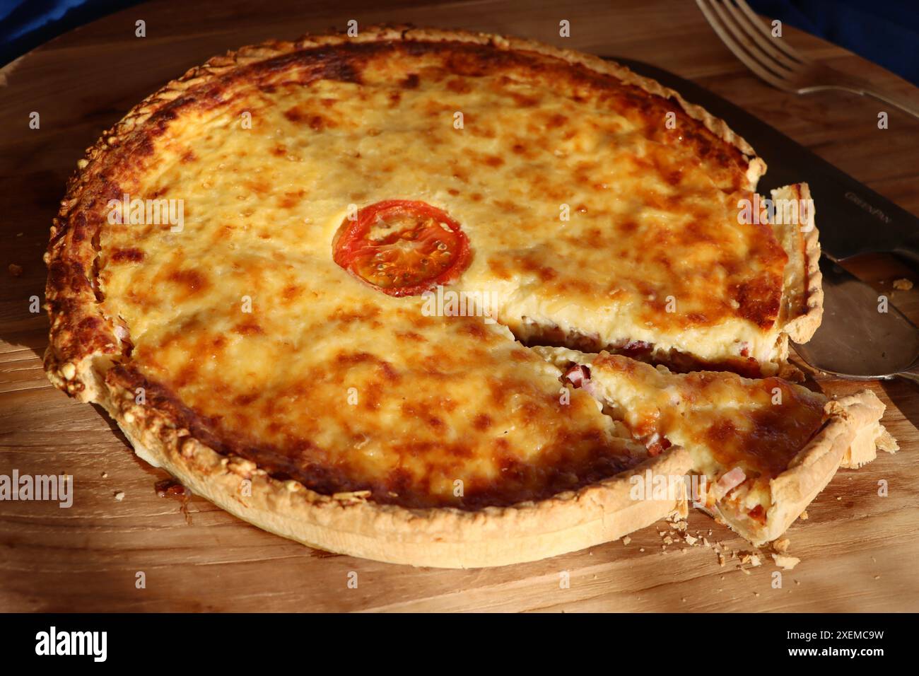 Swedish ham and cheese pie on wood board on midsummer buffet, June 2024 ...