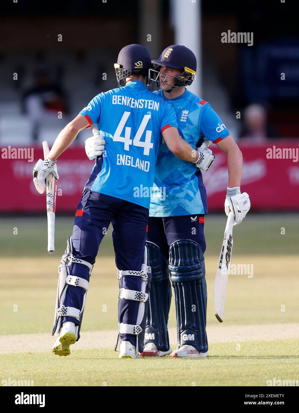 England's Luc Benkenstein reaches a half century and is congratulated by England's Noah Thain ...