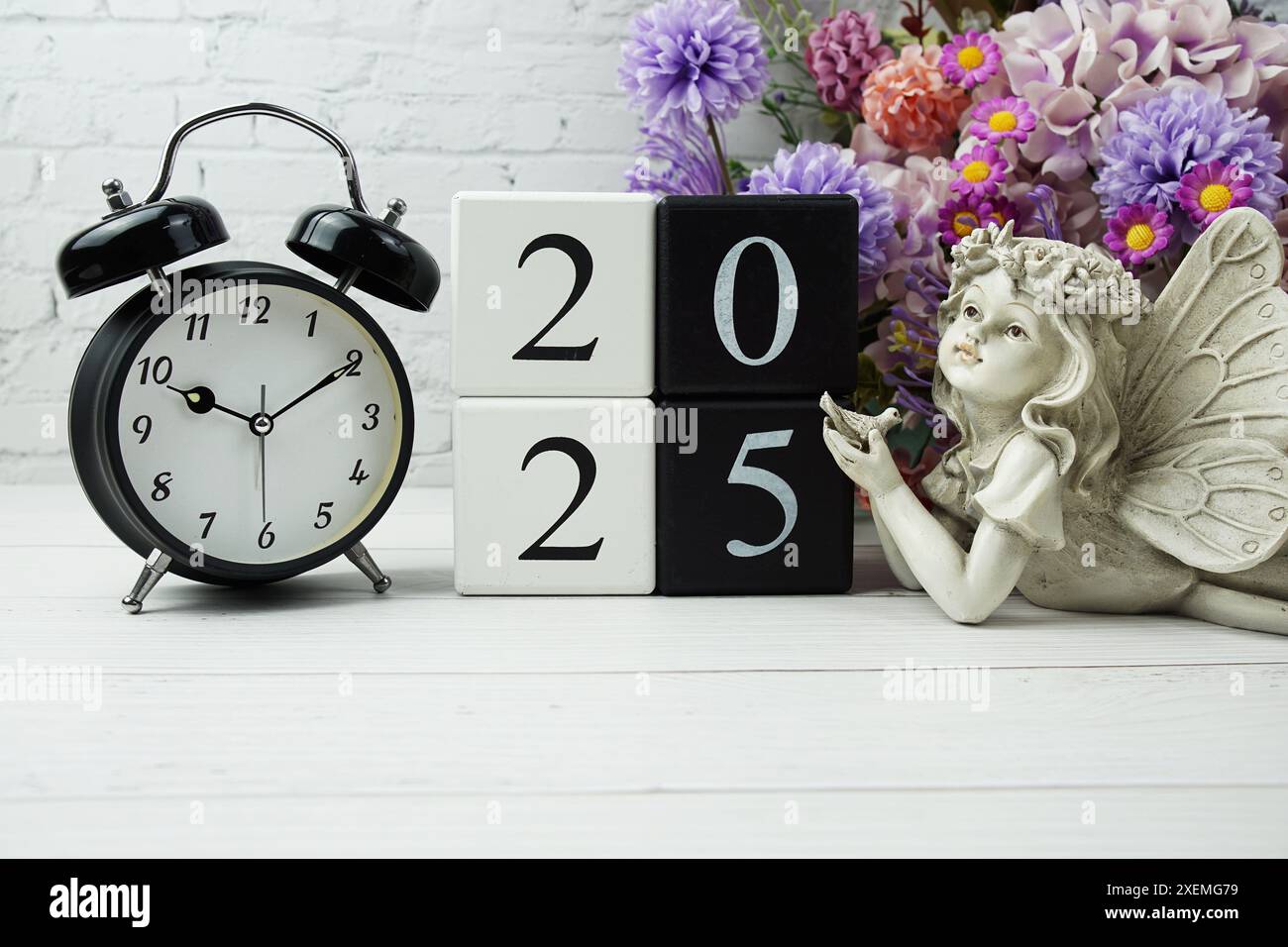 Happy New Year 2025 with wood block number on wooden table background ...