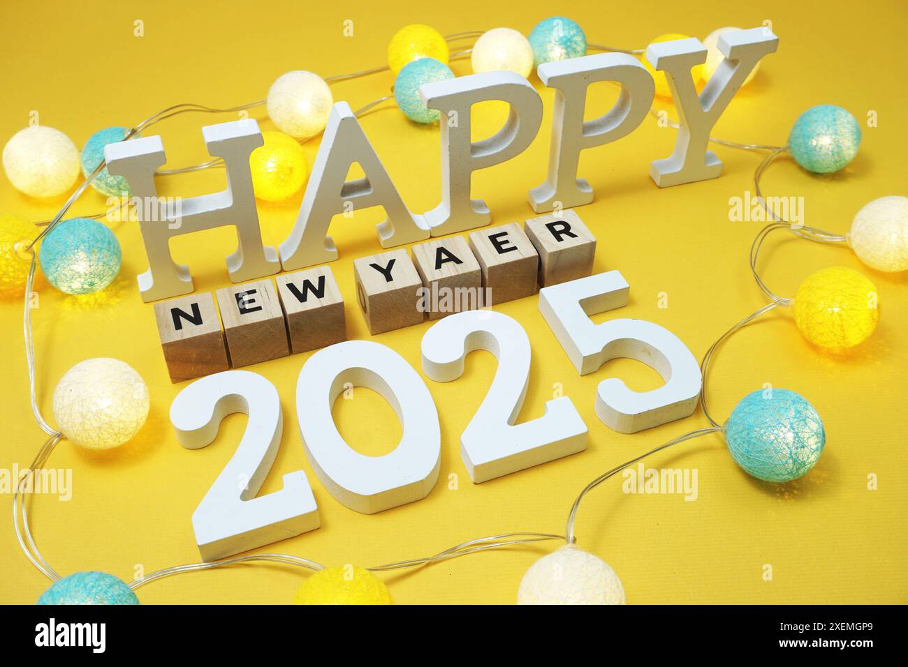 Happy New Year 2025 alphabet letter with LED cotton balls on yellow ...