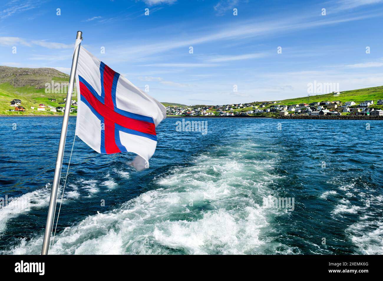 Sailing on the motorboat from the city of Sorvagur to the island of ...