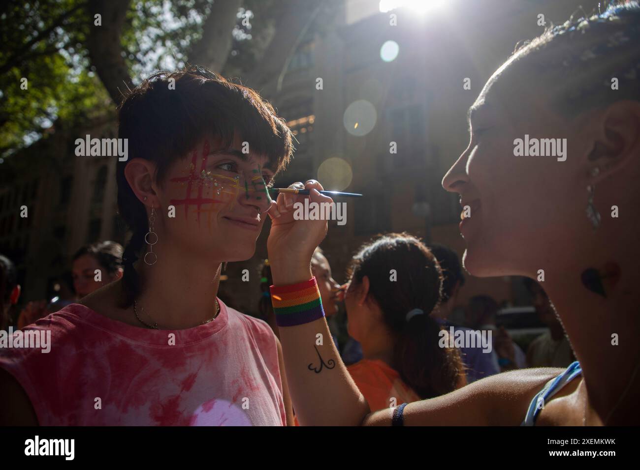 28 June 2024, Spain, Palma: Diana and Maria from Mallorca apply make-up ...