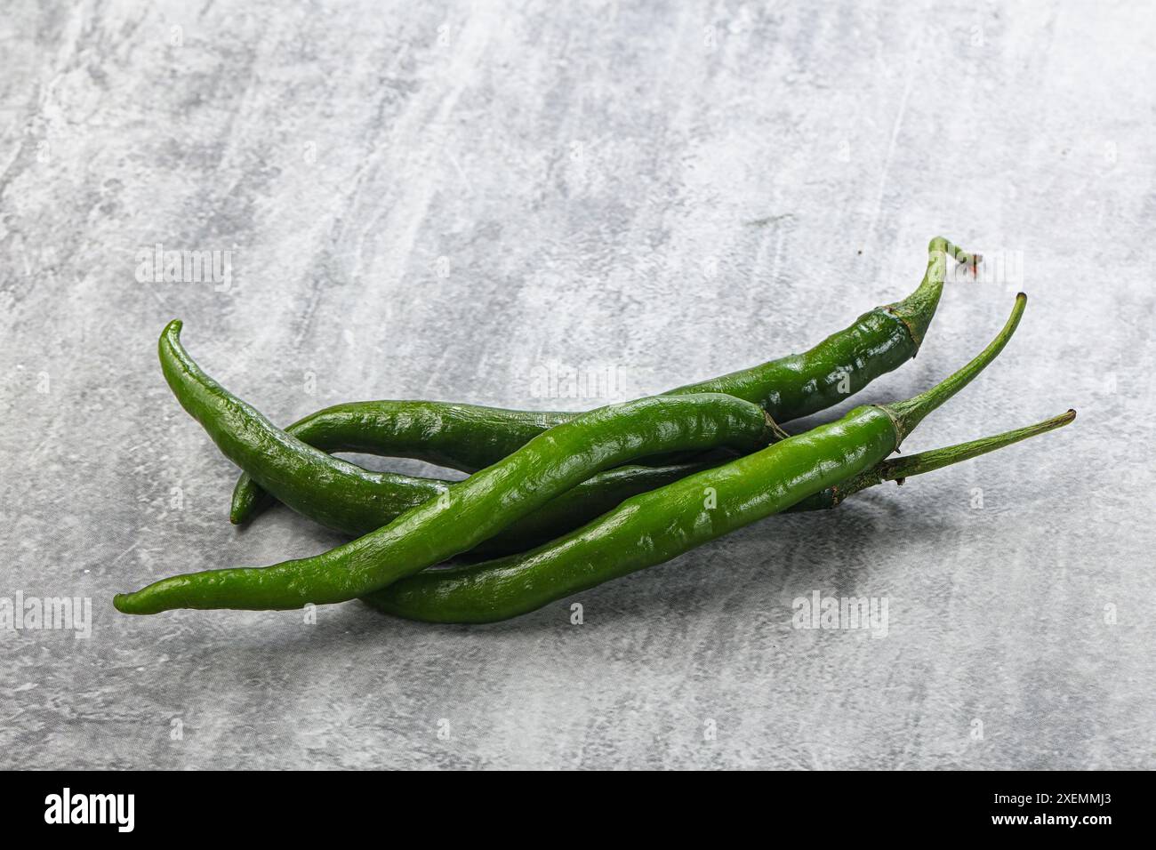 Hot and spicy green chili pepper heap Stock Photo - Alamy