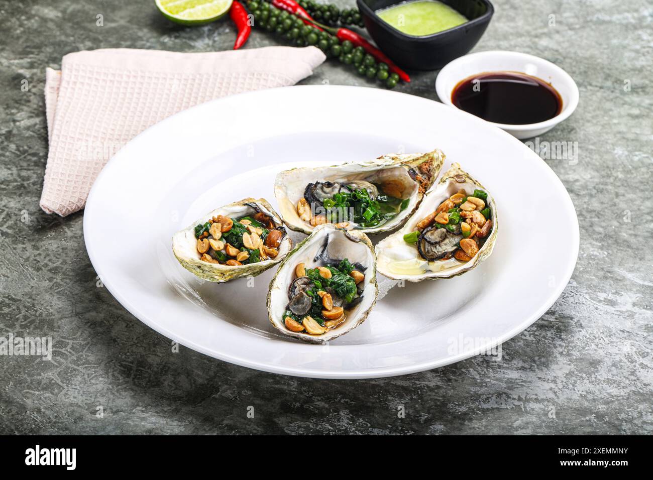Open half oysters with green onion and peanut Stock Photo - Alamy
