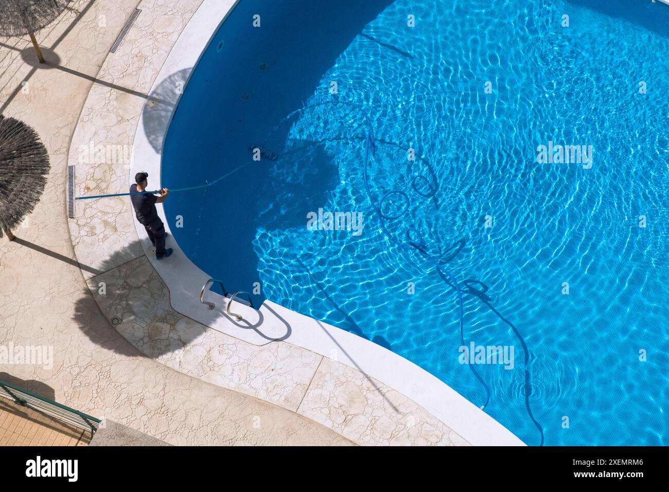 Cleaning and maintenance of swimming pool. Aerial view to maintenance ...