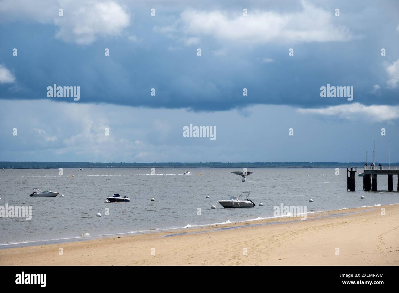 Walking on beach promenade in sunny Arcachon, vacation destination town ...