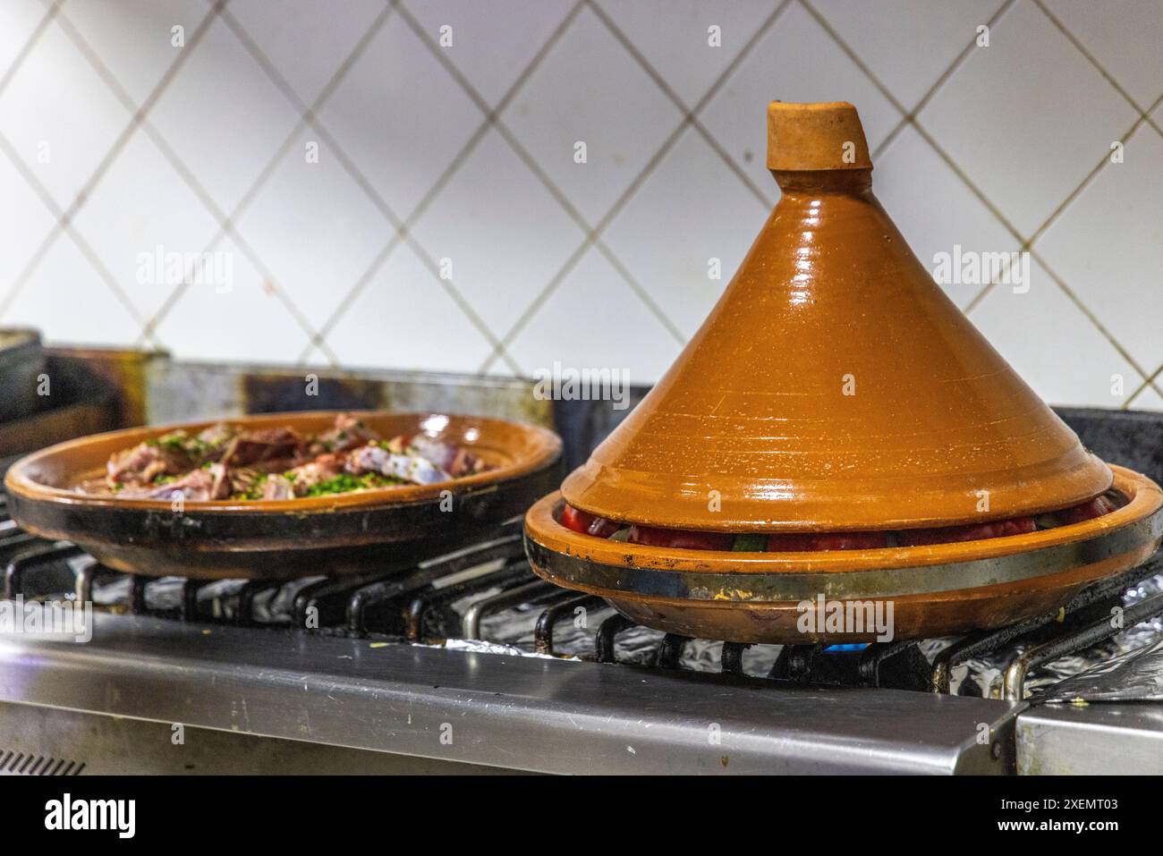 Morocco, Taroudant Province. Hotel Dar Zitoune, cooking food in a ...