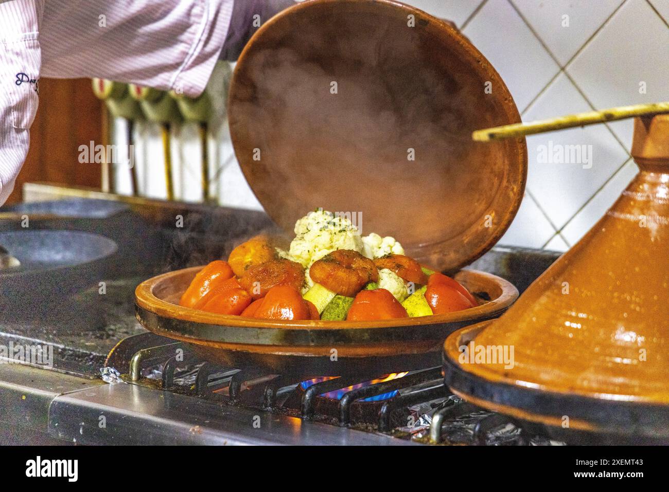 Morocco, Taroudant Province. Hotel Dar Zitoune, cooking food in a ...