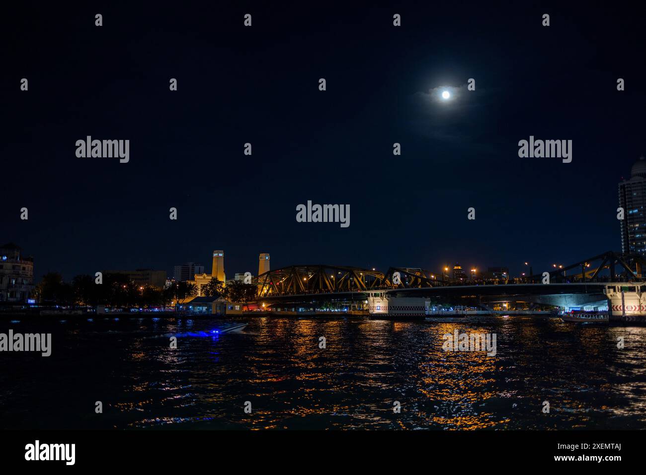 Night time view of the Chao Phraya Sky Park Bridge crossing the Chao ...