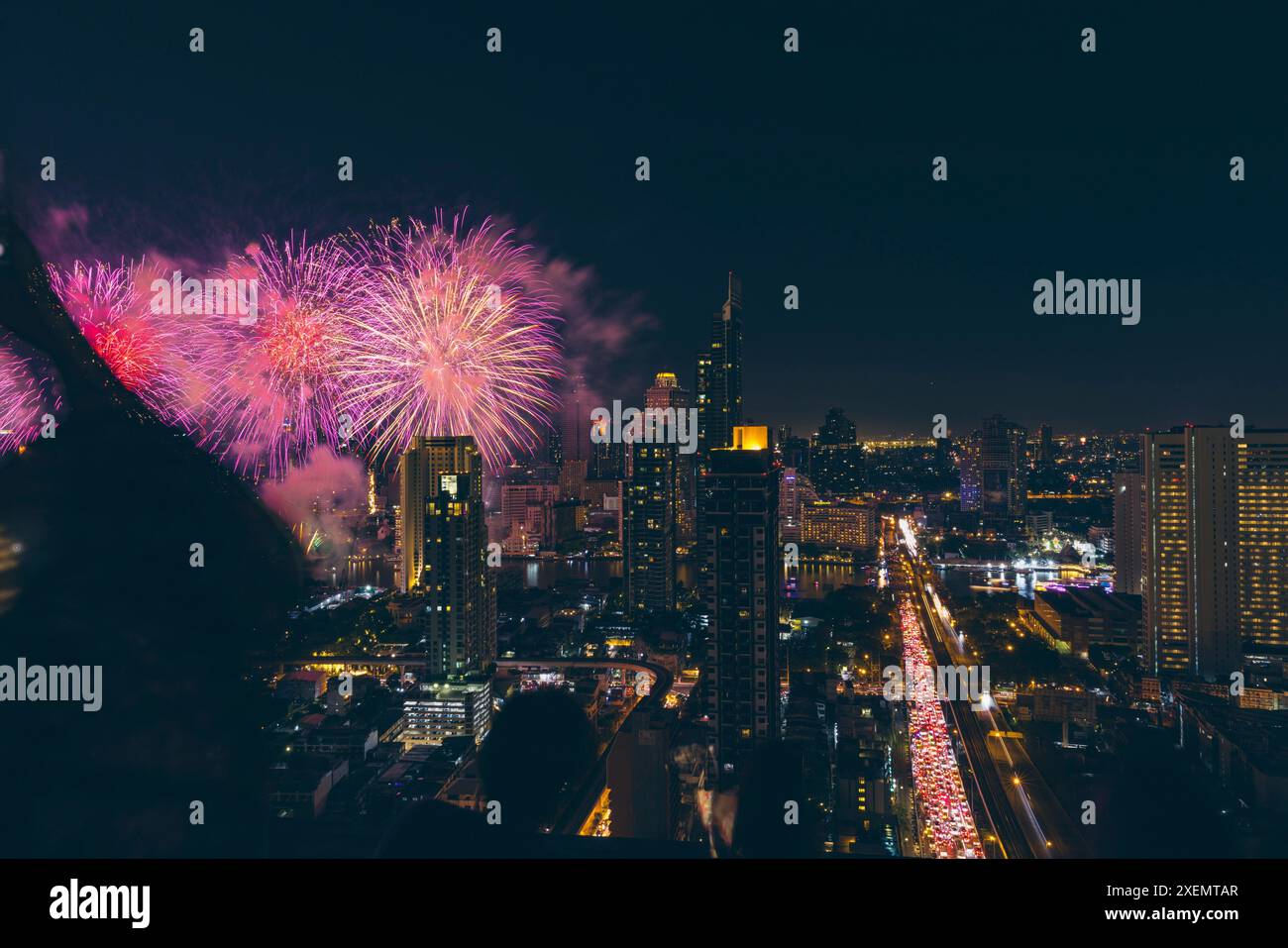 Fireworks light up the night sky over downtown Bangkok on New Years Eve ...